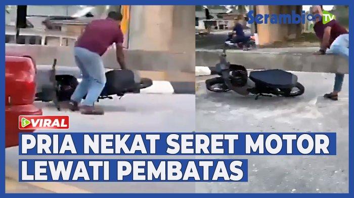 VIDEO - Pria Nekat Seret Motor Lewati Portal Pembatas, Ditegur tapi ...