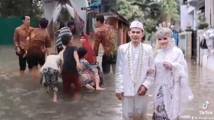 Viral Pesta Nikah Saat Banjir, Pengantin Pilih Foto di Tengah Banjir Bekasi - Tribunlampung.co.id