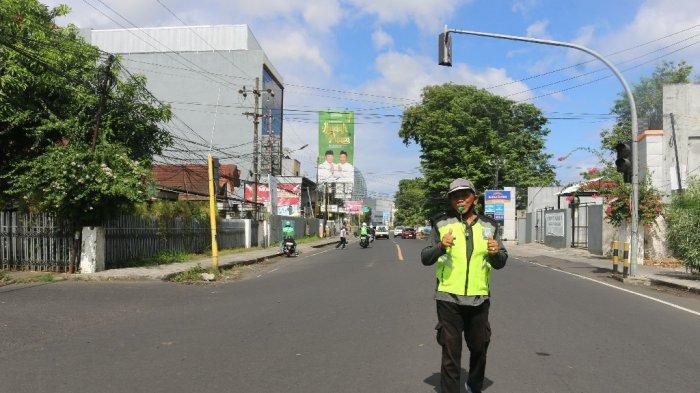 Potret Sosok Pahlawan Lalu lintas di Jalan Bethesda Manado Sulawesi Utara - Tribunmanado.co.id