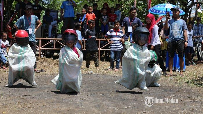 BERITA FOTO Sejumlah Anak Beradu Cepat Dalam Lomba Balap Karung Menggunakan Helem - Tribun-medan.com