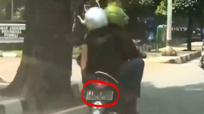 VIRAL Video Pemotor Gunakan Pelat Nomor RI 1, Helm Bentuk Tabung Gas dan Teko - Tribunpekanbaru.com